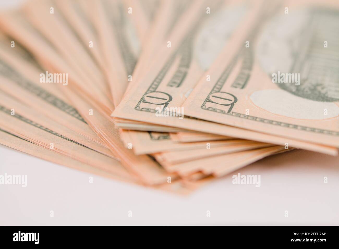 a ten dollar bills on white background Stock Photo - Alamy