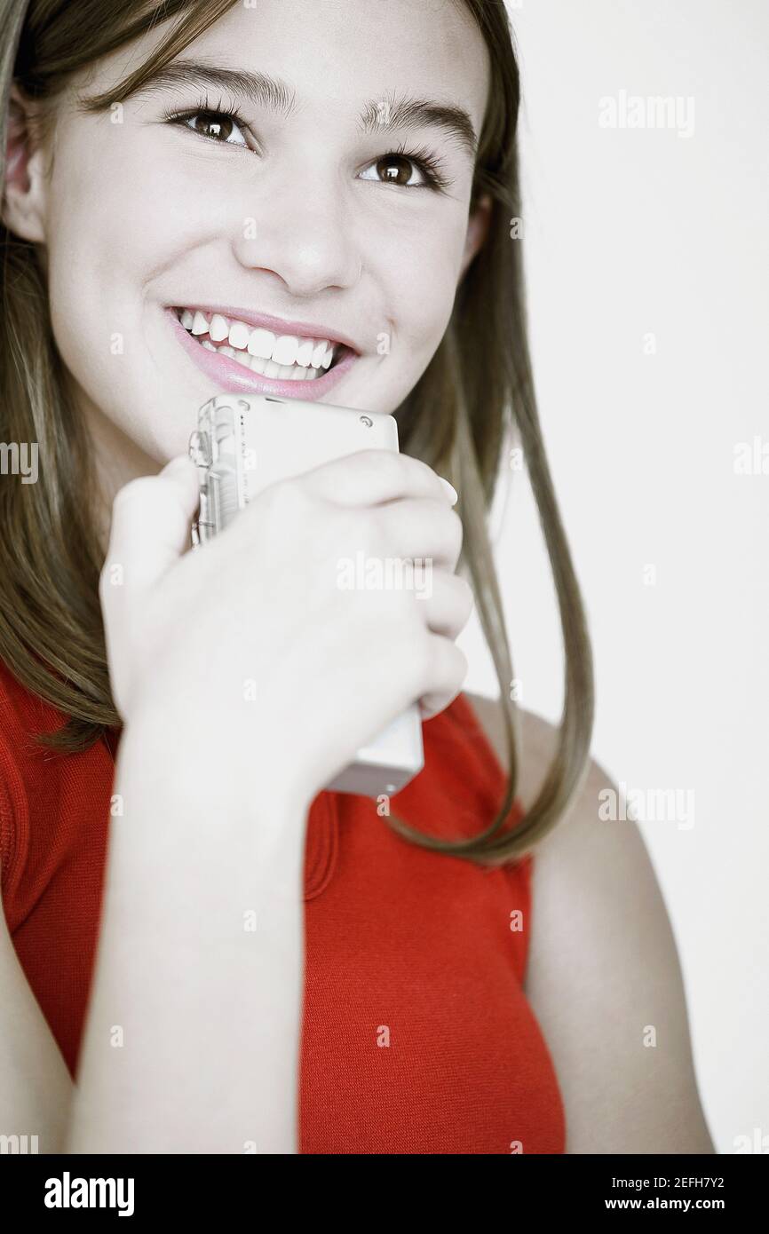 Close up of a teenage girl listening to a tape recorder Stock Photo - Alamy