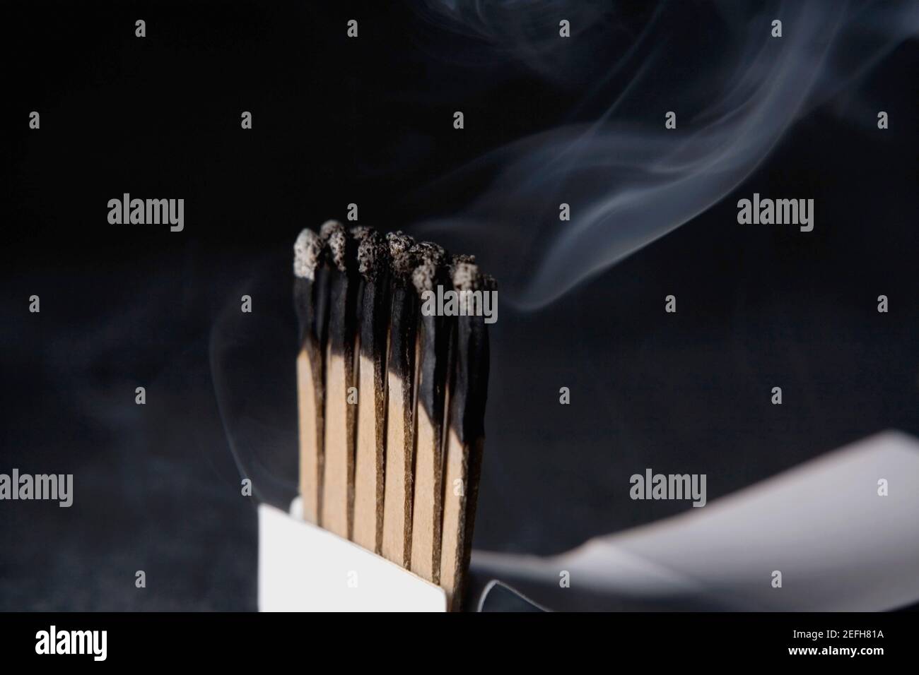 Burnt matchsticks in black background hi-res stock photography and ...