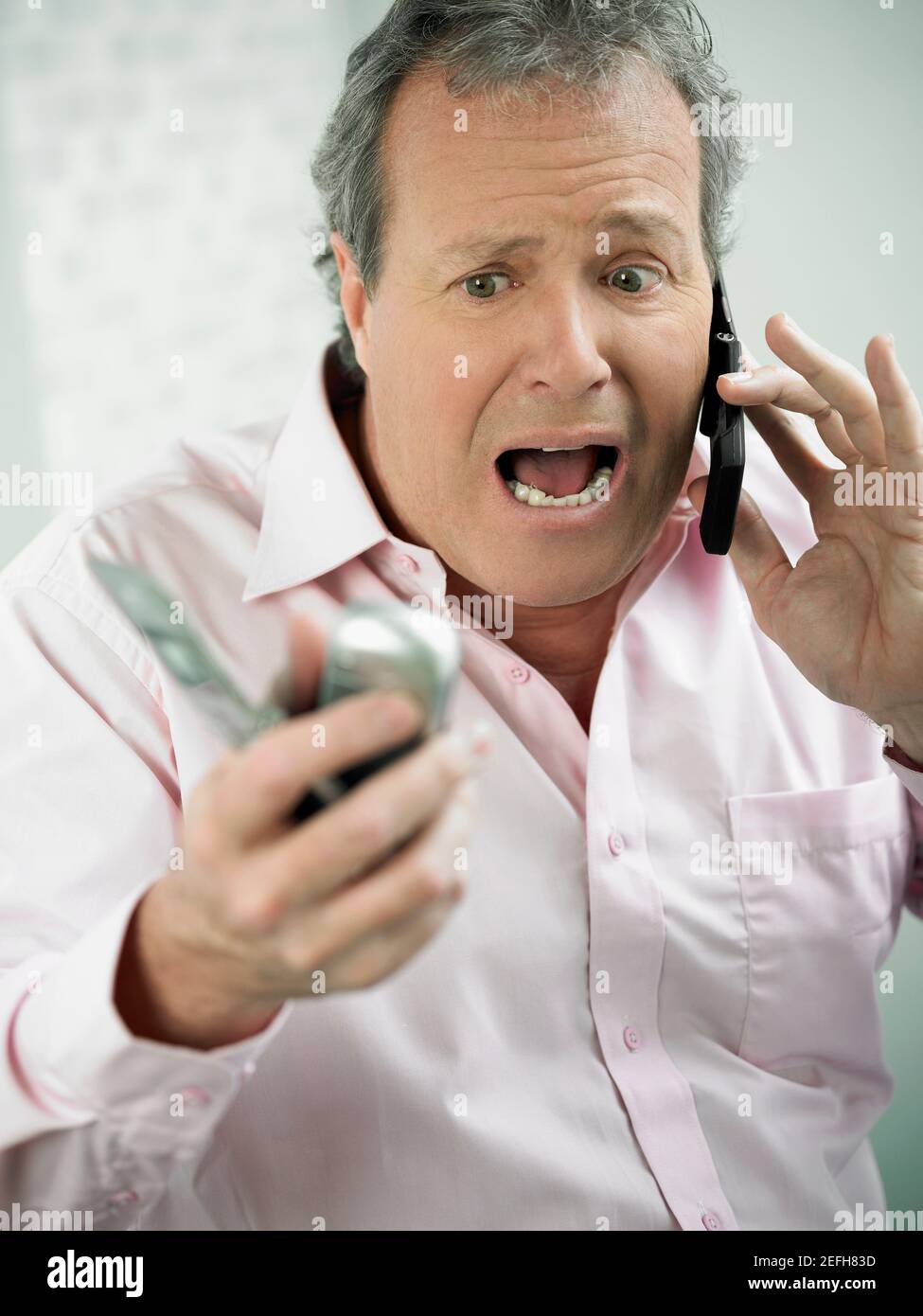 Cell phones people looking down focus hi-res stock photography and ...