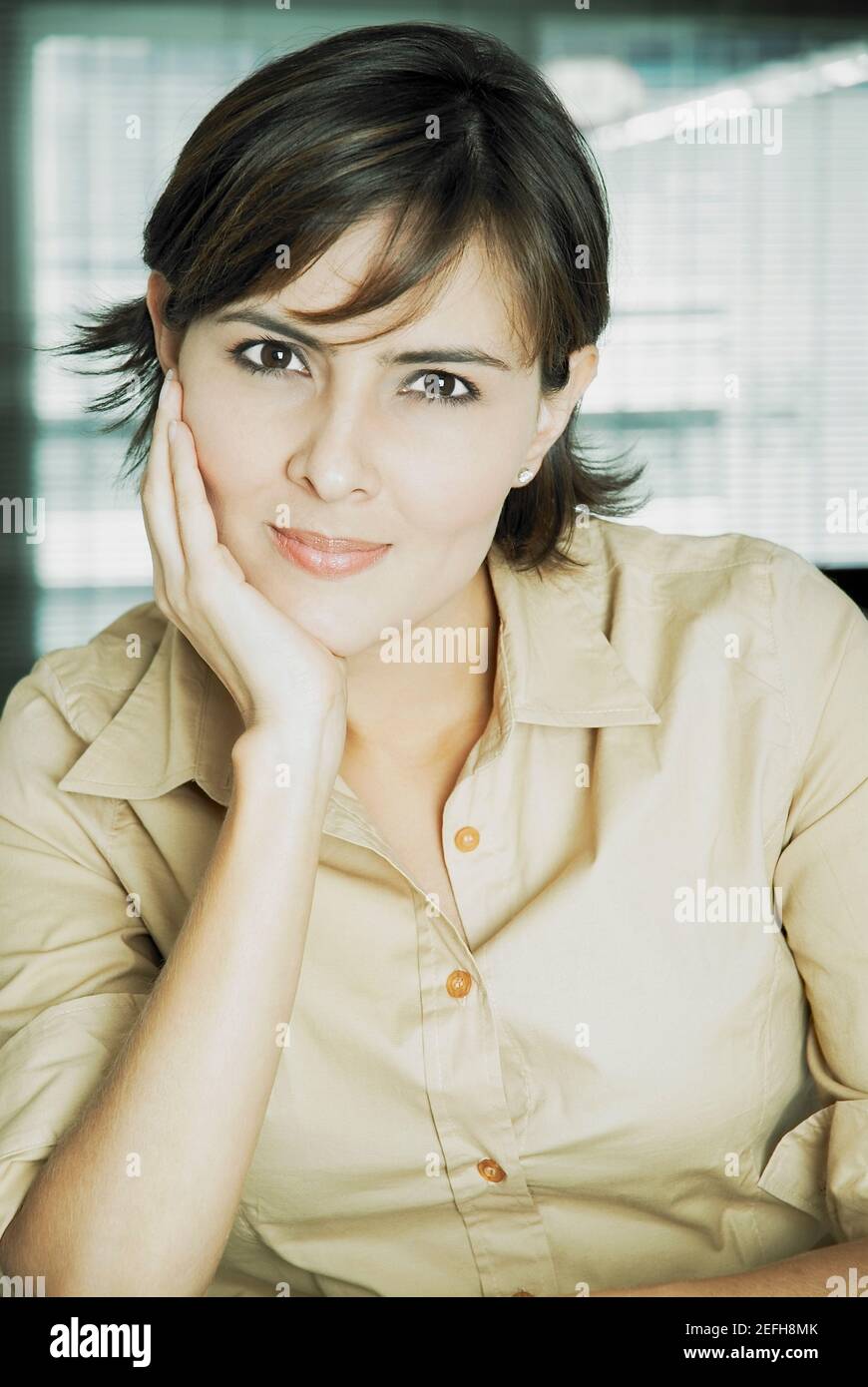 Portrait of a mid adult woman thinking Stock Photo - Alamy