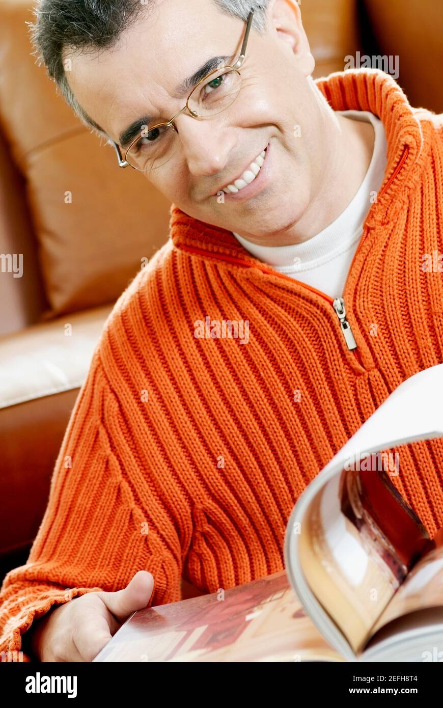 Person holding magazine front page hi-res stock photography and images ...