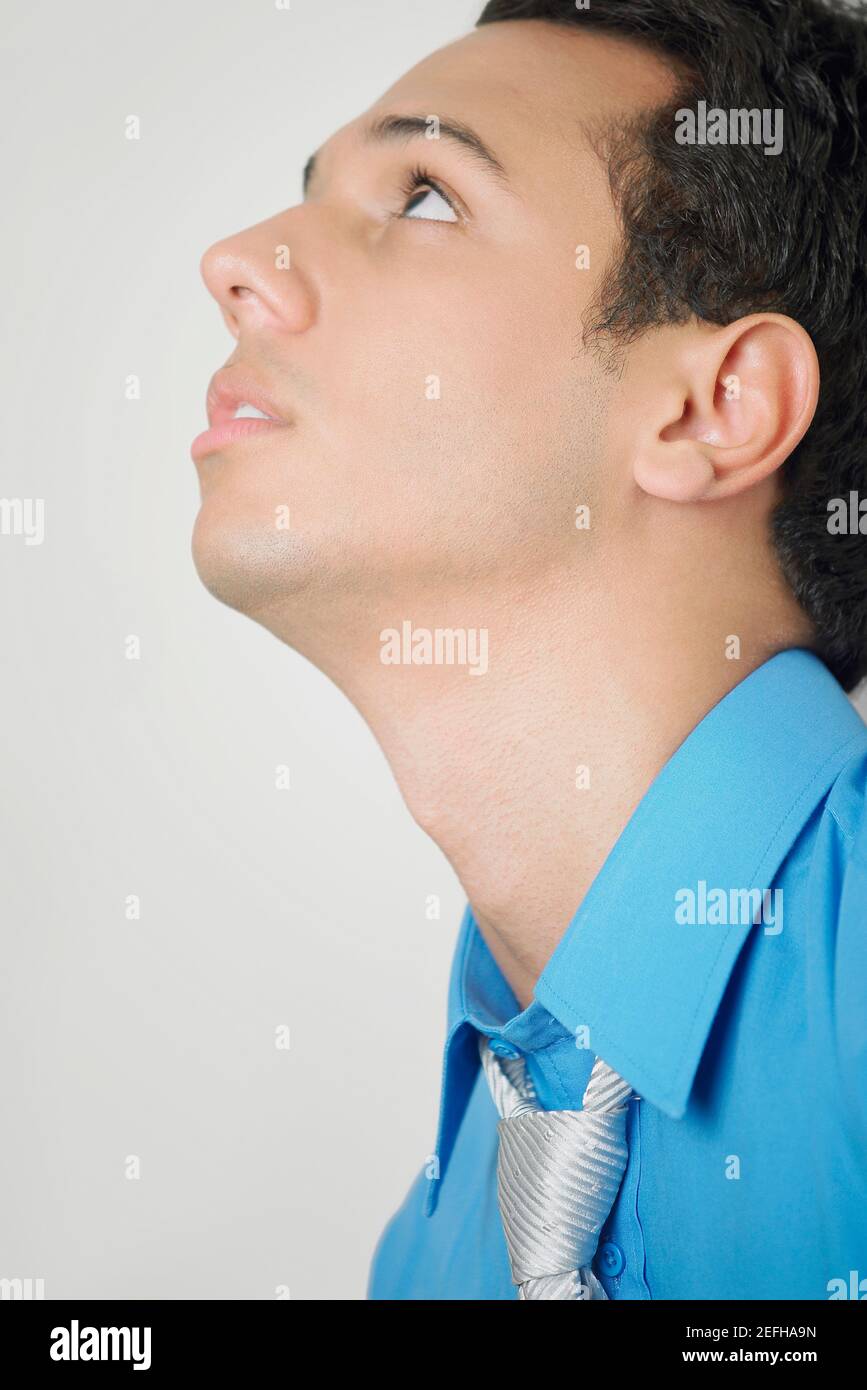 Side profile of a businessman looking up Stock Photo - Alamy