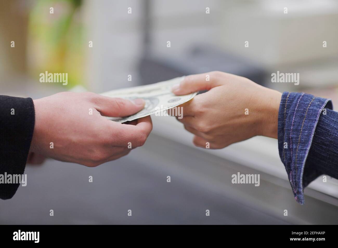 PeopleŽs hands exchanging paper currency Stock Photo - Alamy