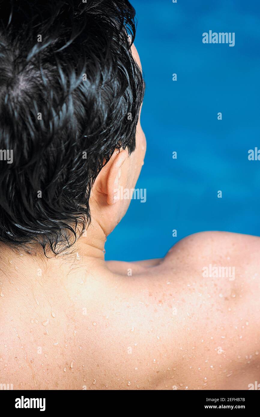 Rear view of a man in a swimming pool Stock Photo - Alamy