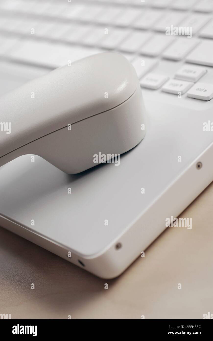 Close up of a telephone receiver on a laptop Stock Photo - Alamy