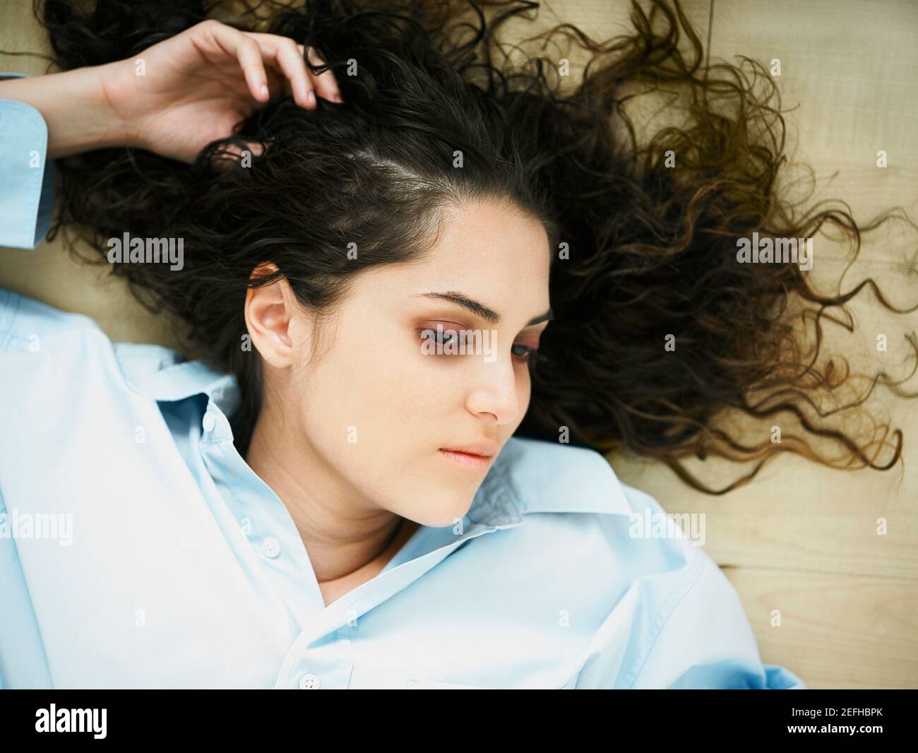 Close up of a young woman lying on her back Stock Photo - Alamy