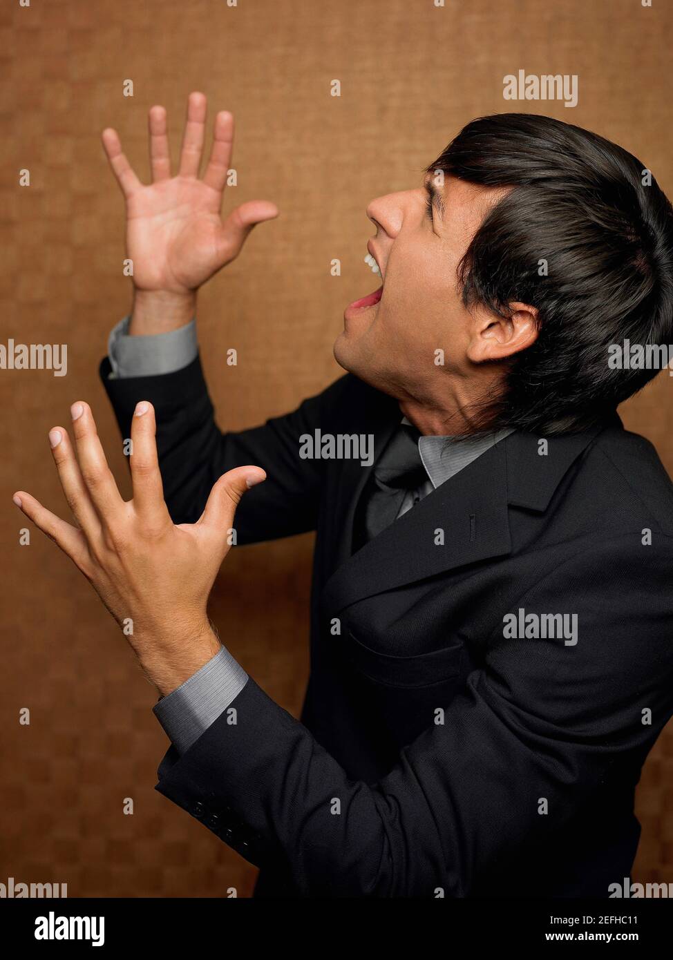 Side profile of a businessman shouting Stock Photo - Alamy