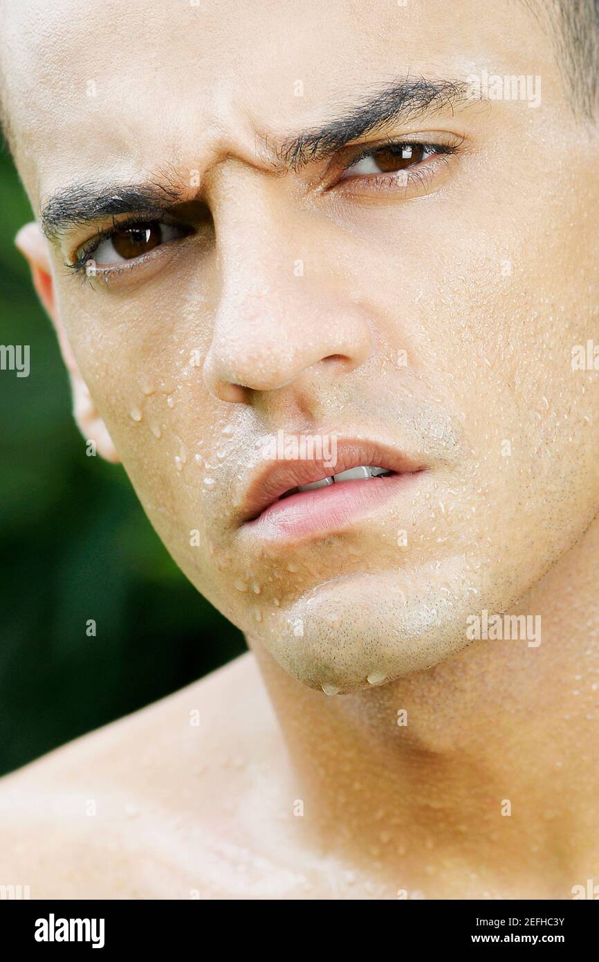 Portrait of a young man looking serious Stock Photo - Alamy