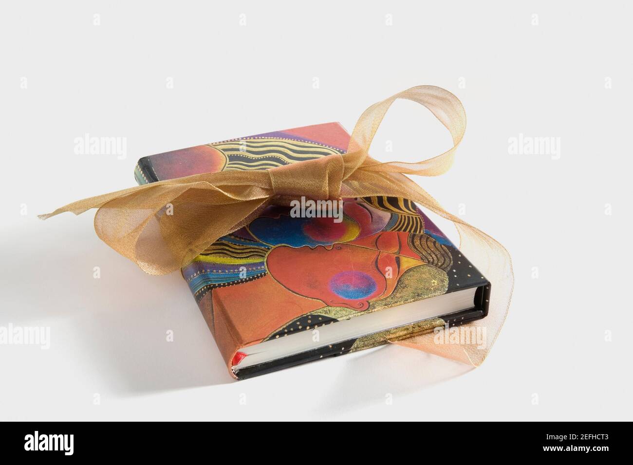 Close up of a book with a bow tied around it Stock Photo - Alamy