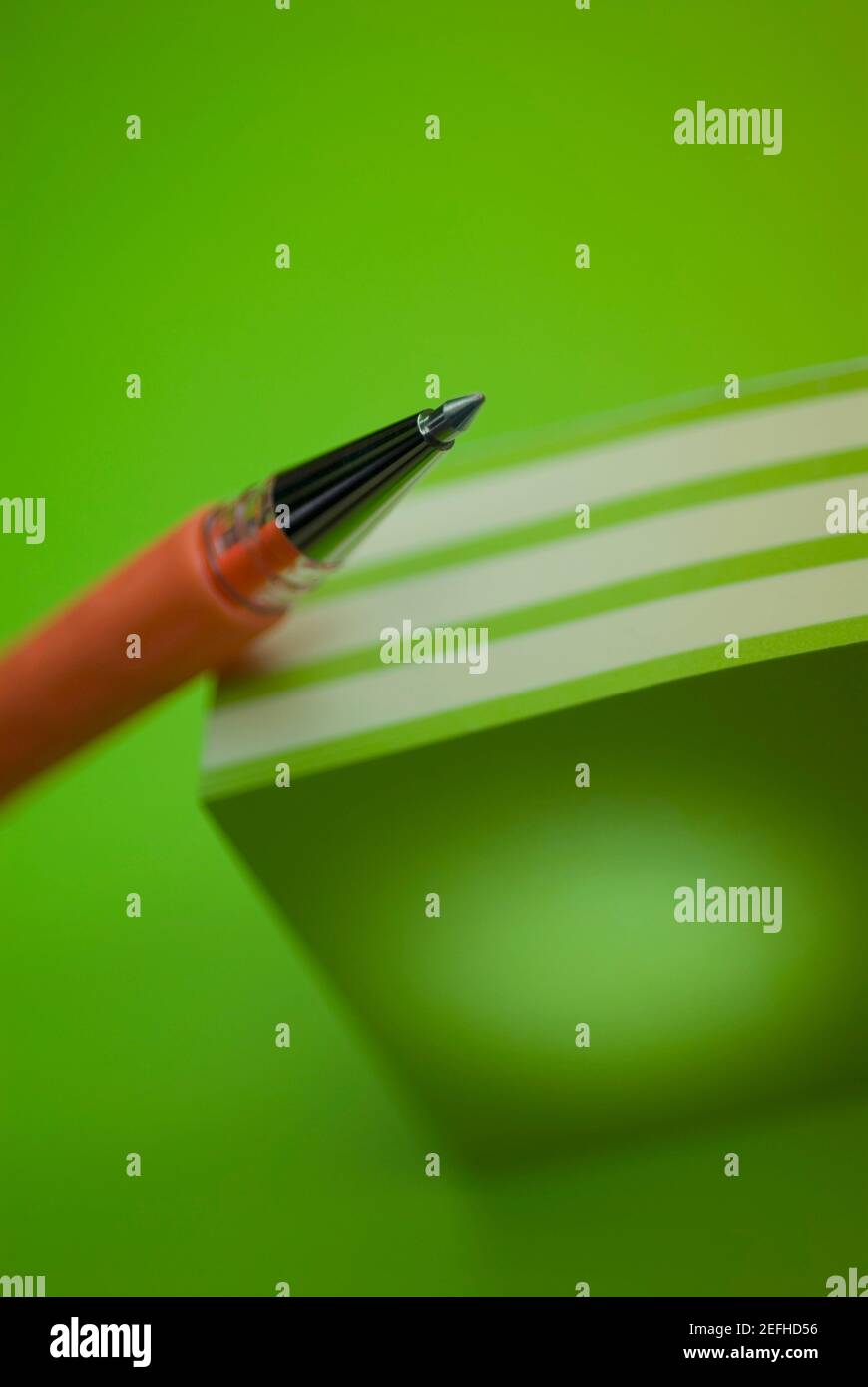 Close up of a pen on a stack of colored post it notes Stock Photo - Alamy