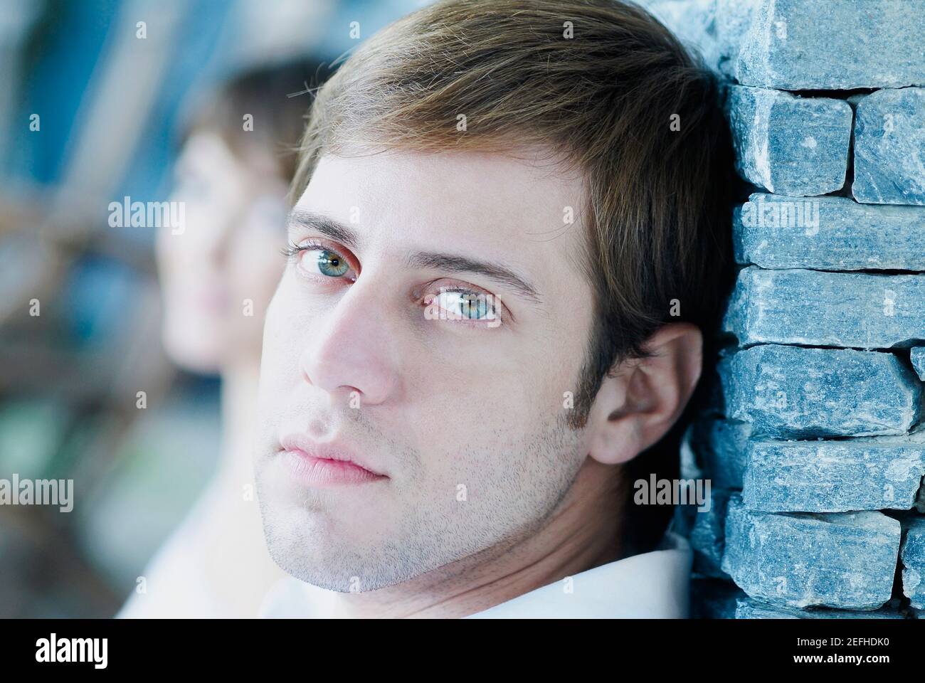 Portrait of a young man thinking Stock Photo - Alamy