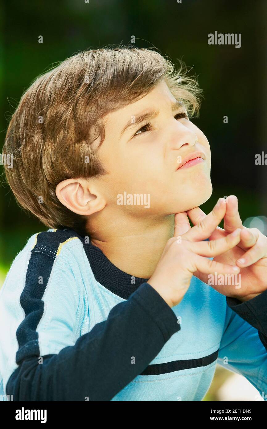 Close up of a boy thinking Stock Photo - Alamy
