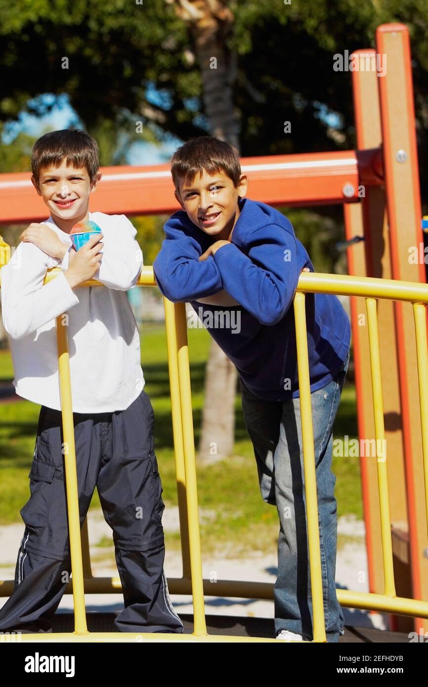 Portrait of two brothers standing together Stock Photo - Alamy