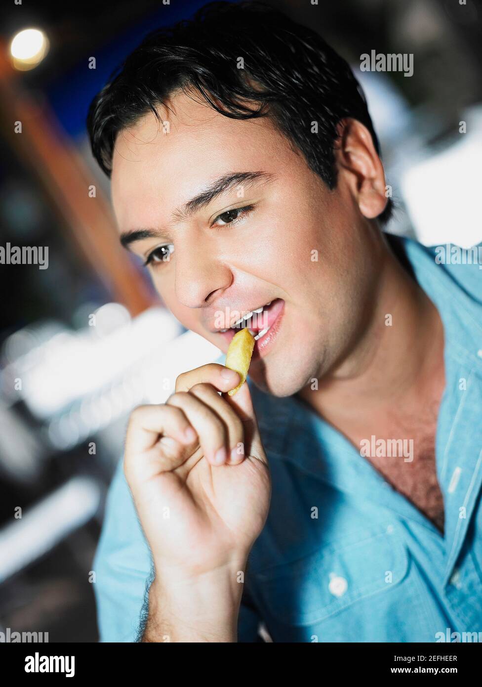 Man eating french fries hi-res stock photography and images - Alamy