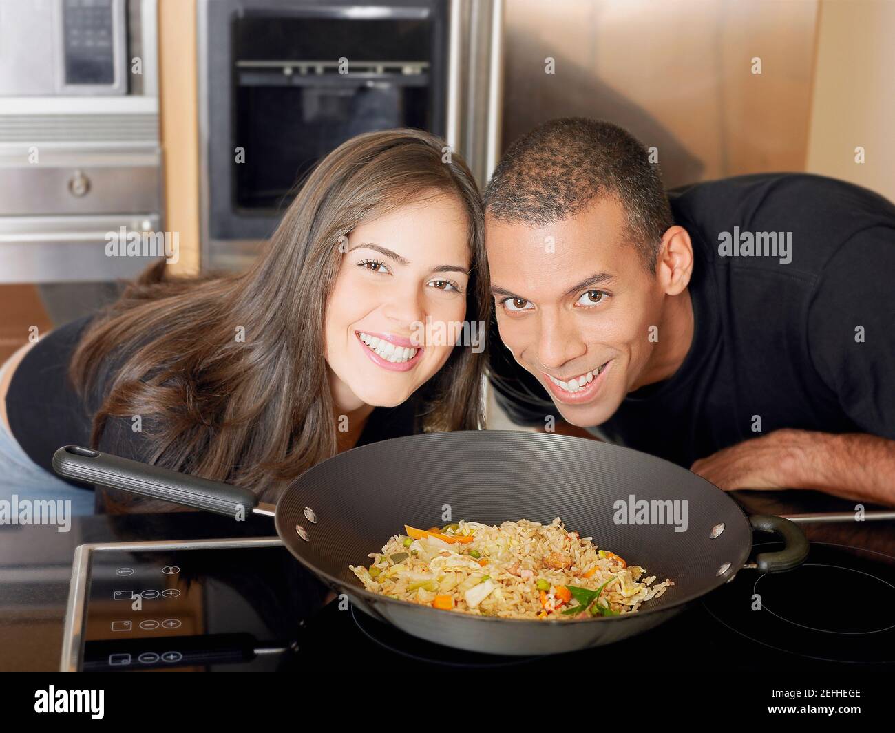 Young woman looking from behind hi-res stock photography and images - Alamy