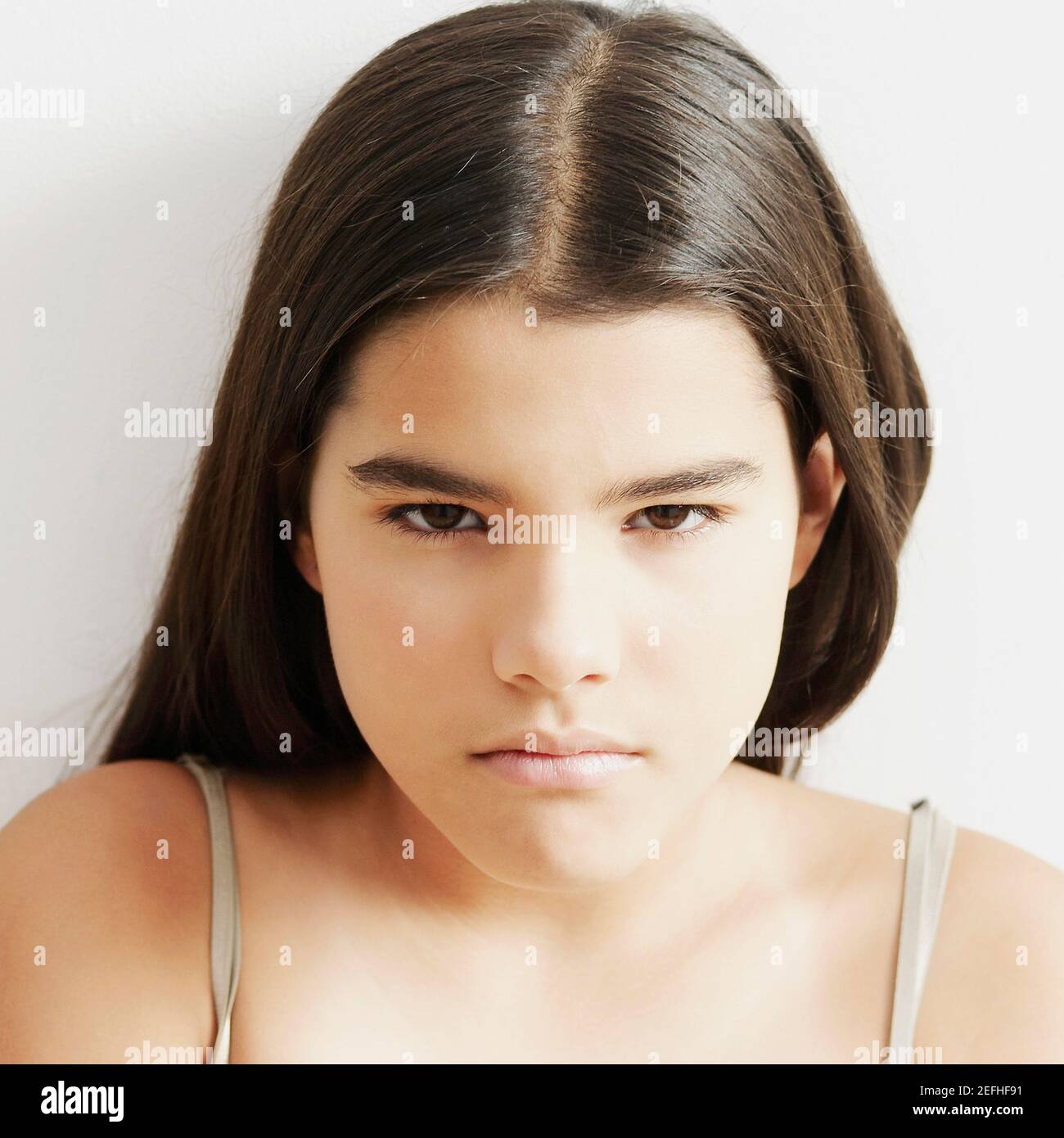 Portrait of a girl looking serious Stock Photo - Alamy
