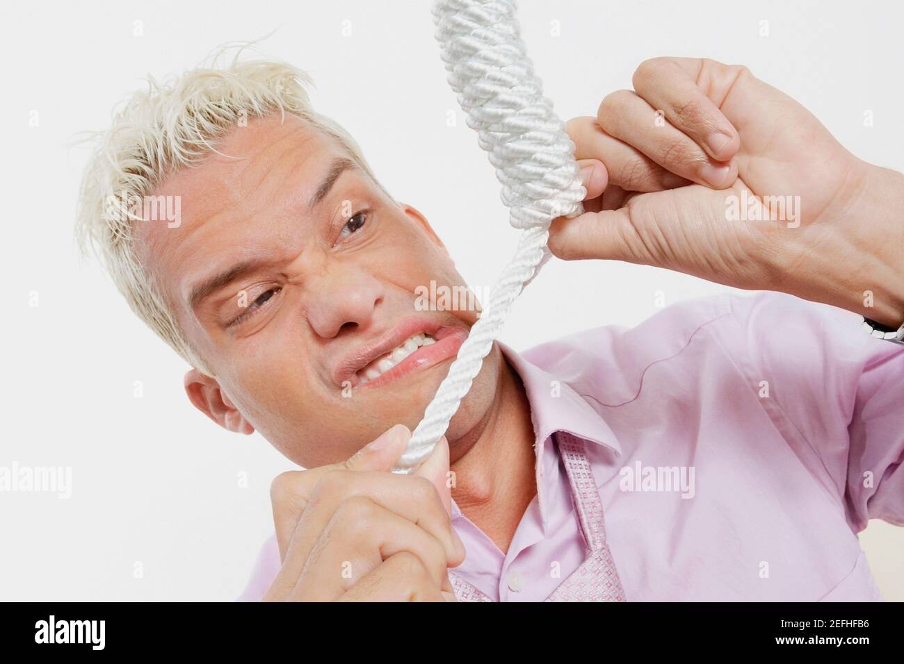 Close up of a young man with a noose around his neck Stock Photo - Alamy