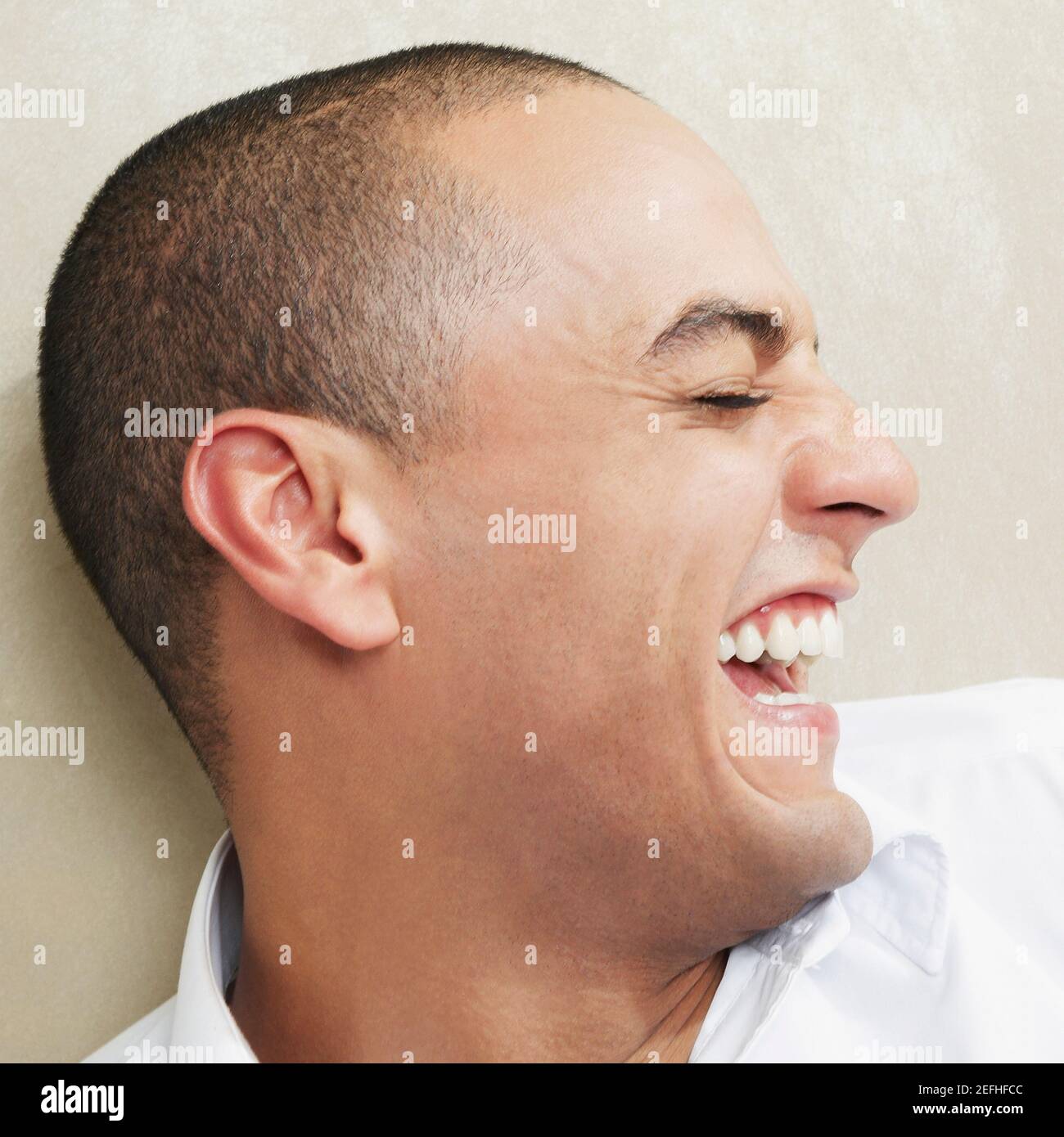 Young man smiling eyes closed hi-res stock photography and images - Alamy