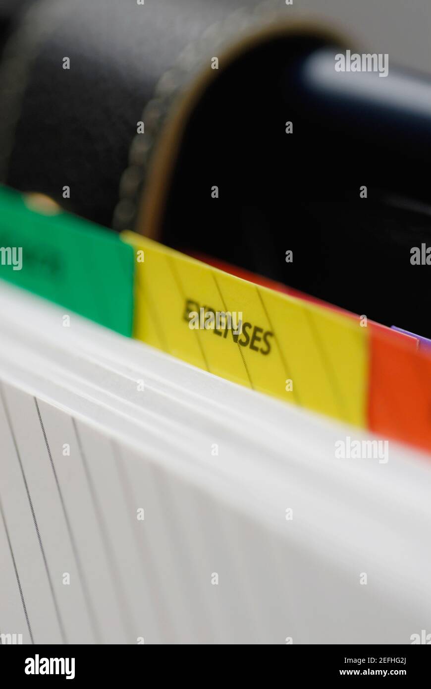 Close up of expenses symbol of a personal organizer Stock Photo - Alamy