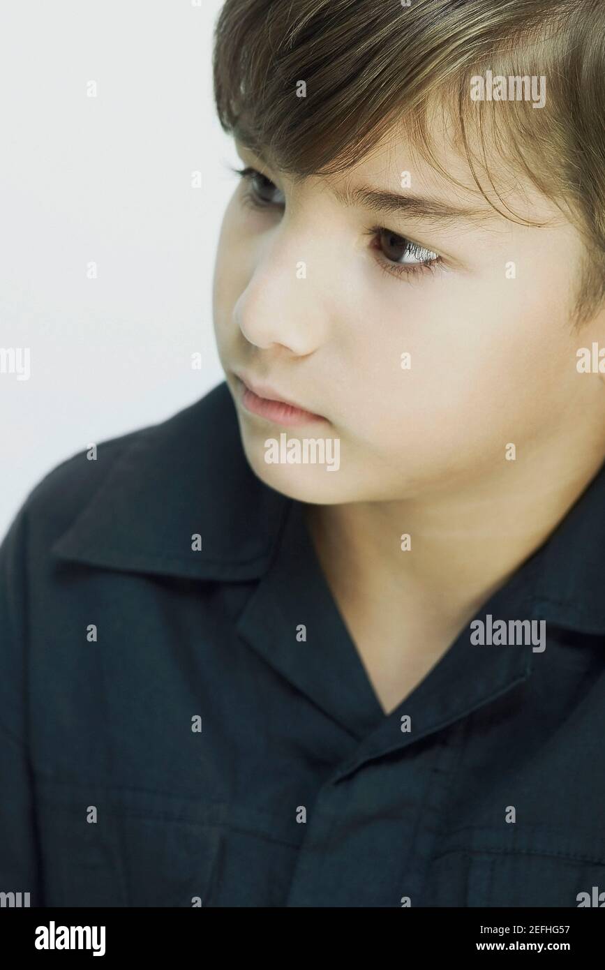 Close up of a boy looking sideways Stock Photo - Alamy