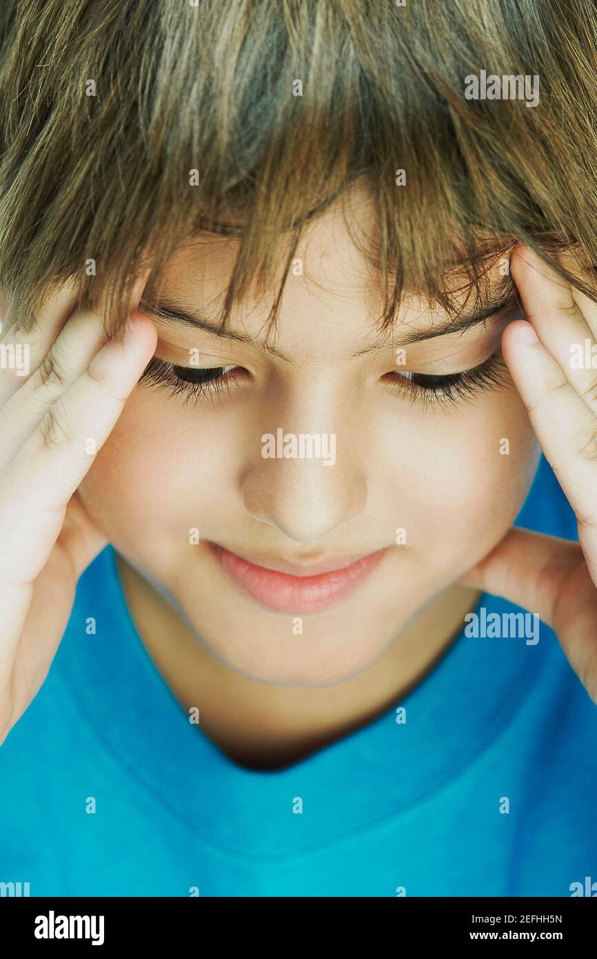 Boy with his head in his hands hi-res stock photography and images - Alamy
