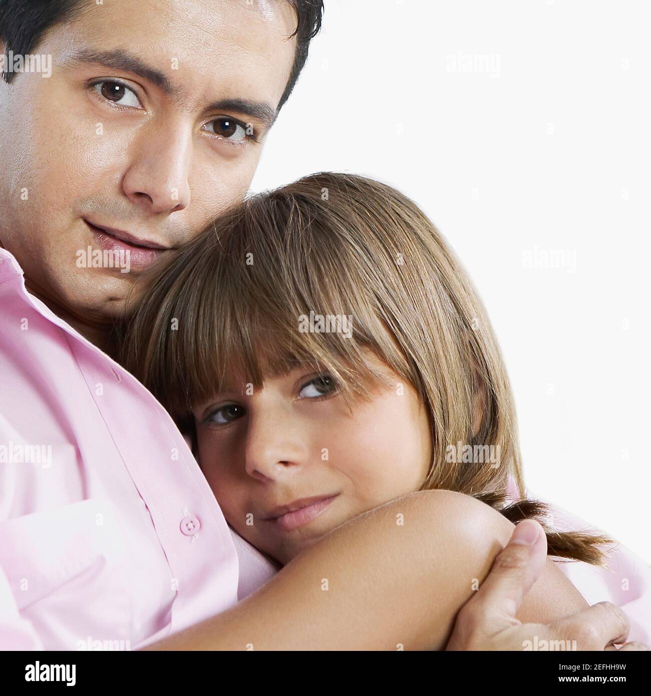 Hispanic father hugging young daughter hi-res stock photography and ...