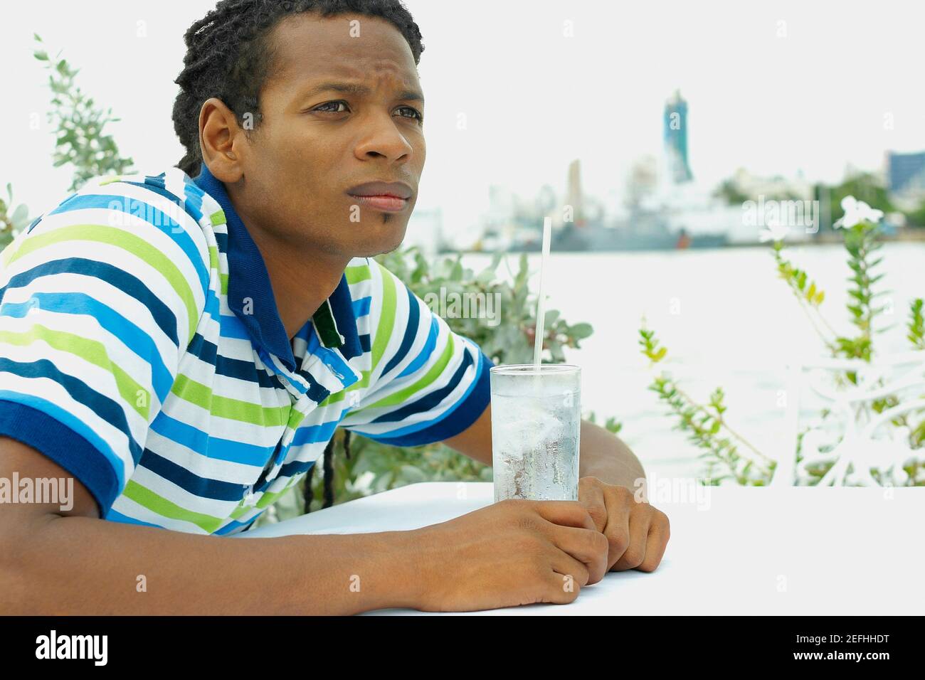 Black adult male sitting table hi-res stock photography and images - Alamy