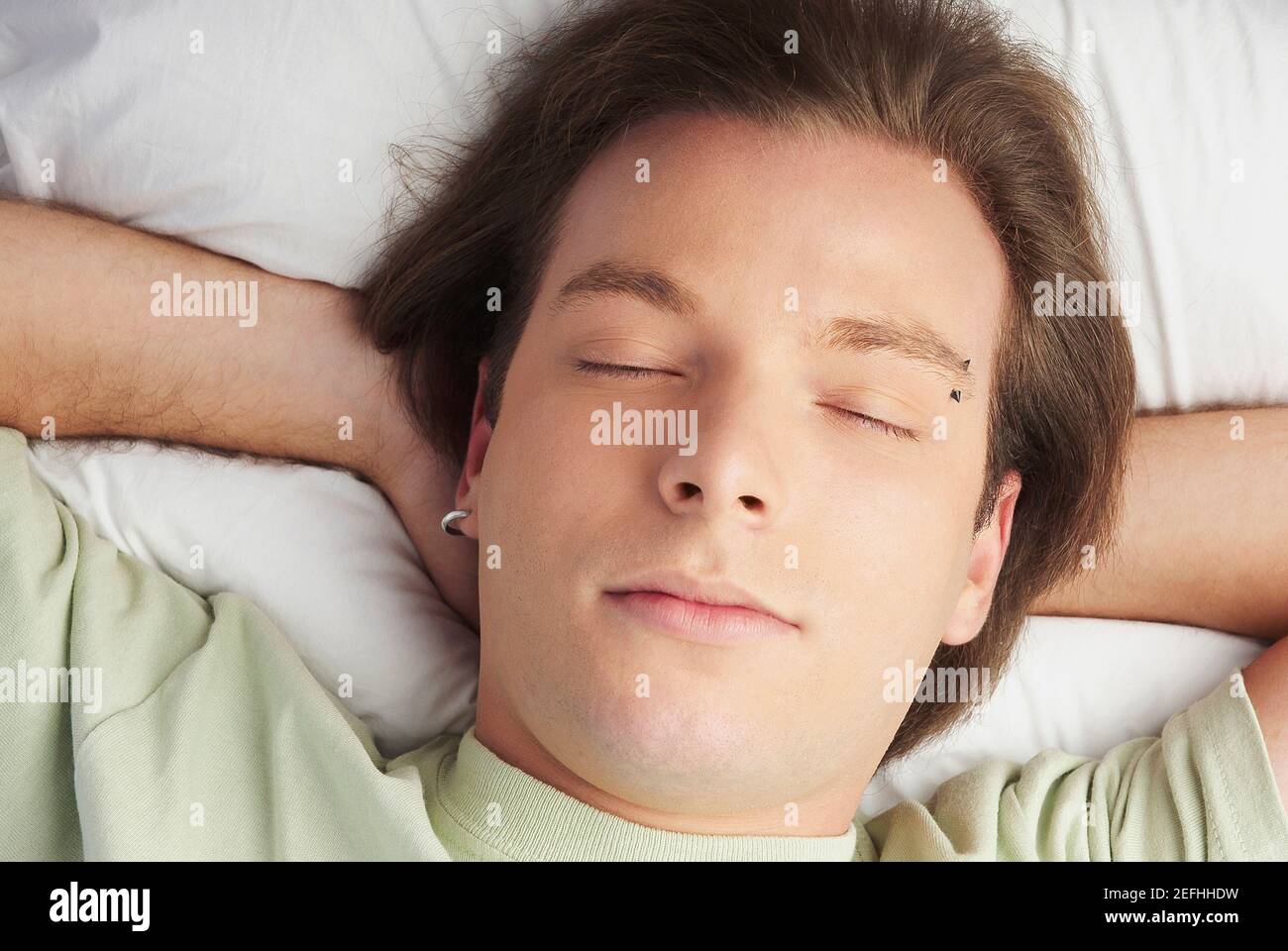 Hands behind head from back man hi-res stock photography and images - Alamy