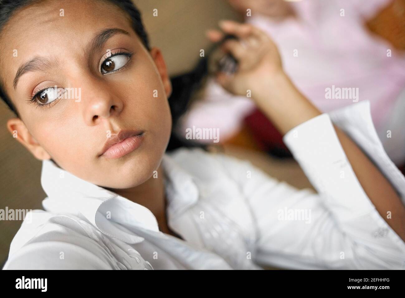 Close up of a teenage girl thinking Stock Photo - Alamy