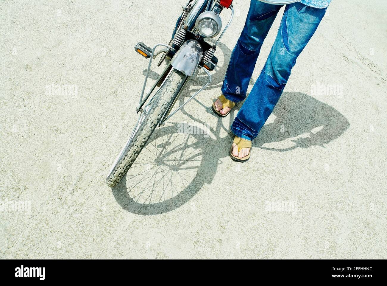 Low section view of a man with a bicycle Stock Photo - Alamy