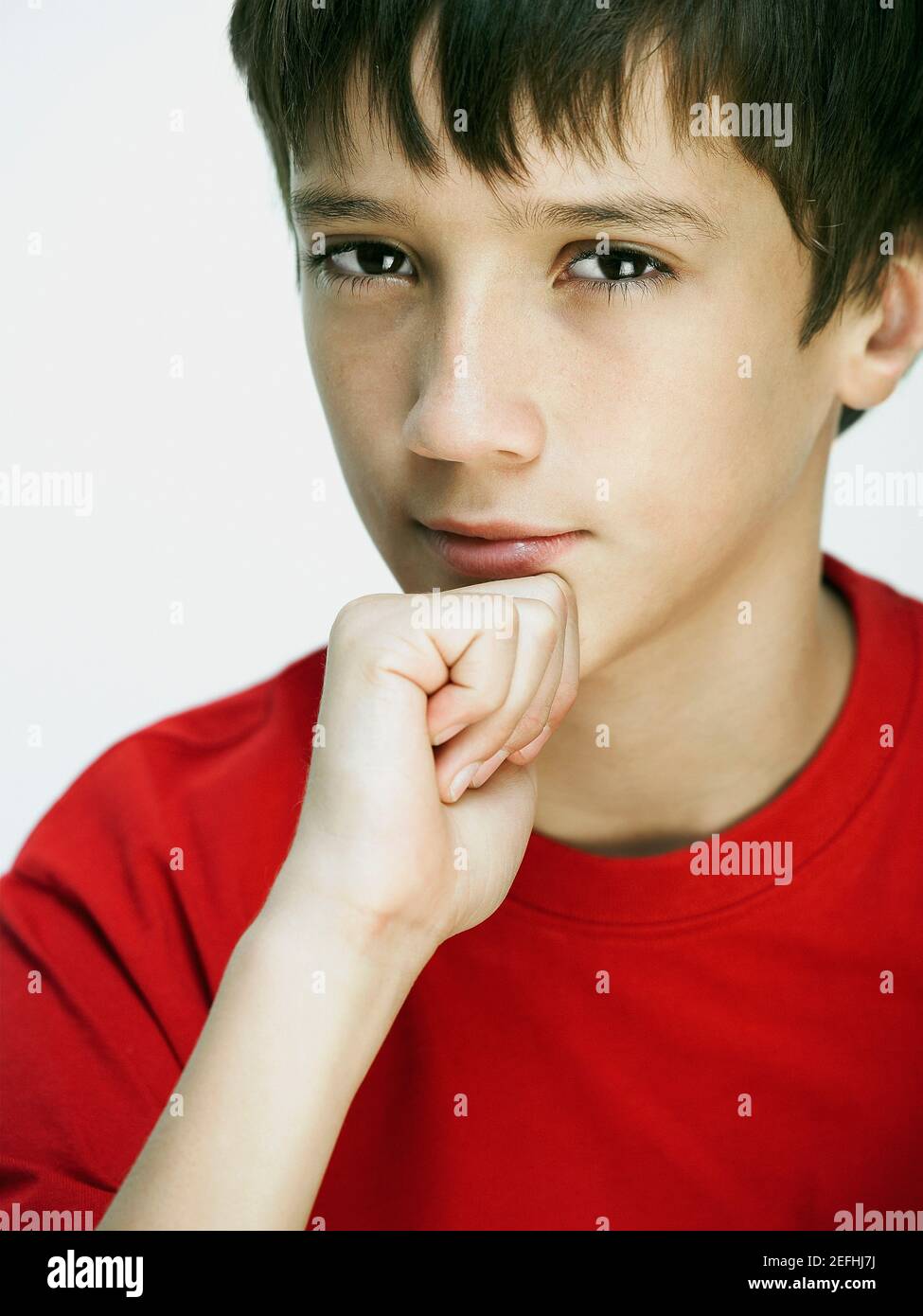 Boy thinking hand chin portrait hi-res stock photography and images - Alamy