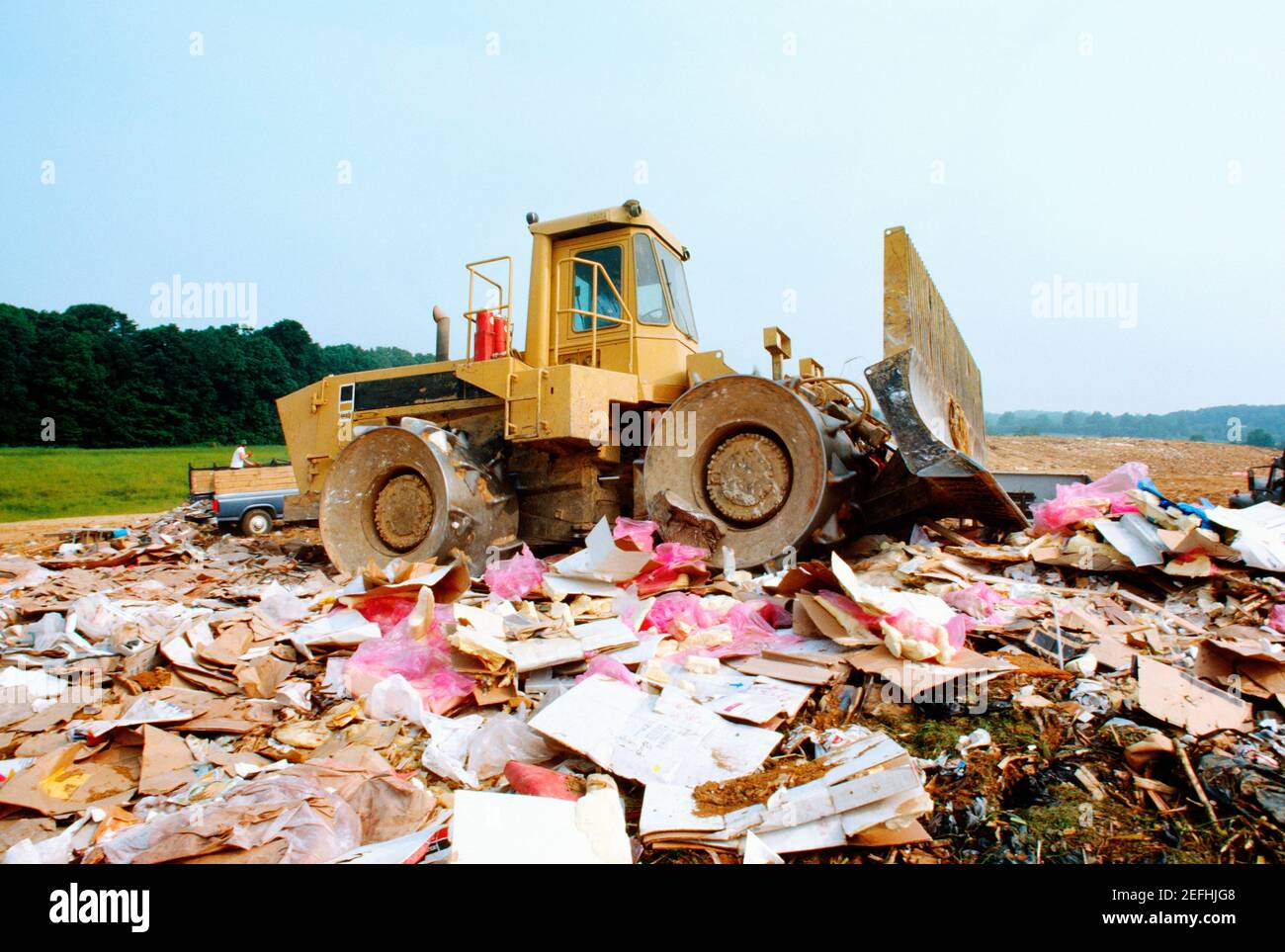 Garbage dump bulldozer hi-res stock photography and images - Alamy