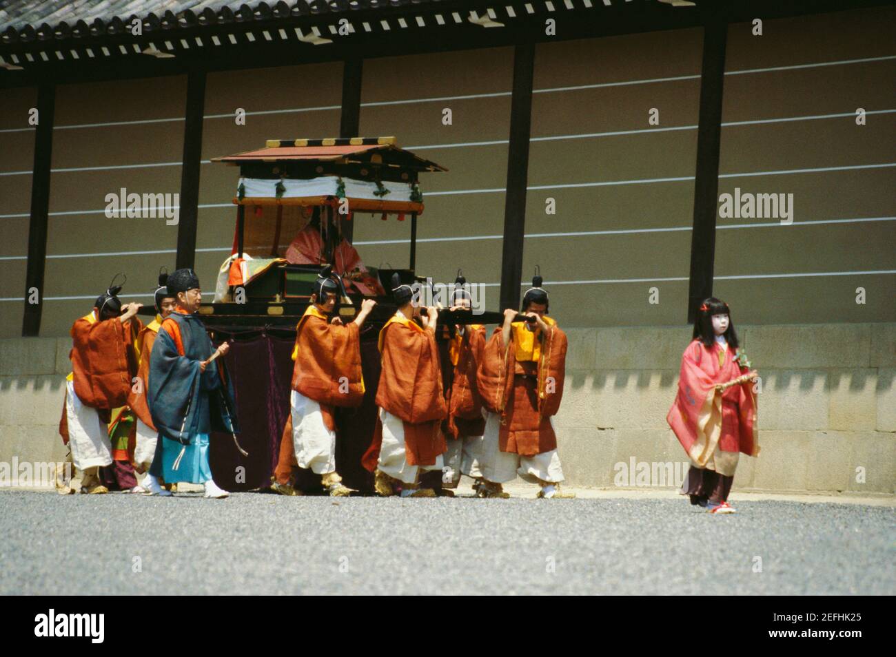 Group of people walking in a procession, Hollyhock festival, Kyoto ...