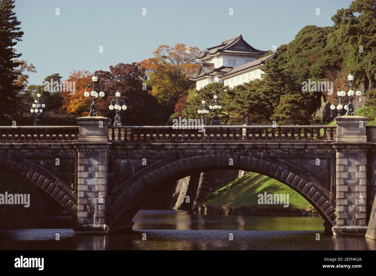 Bridge across a river with a palace in the background, Nijubashi Bridge ...