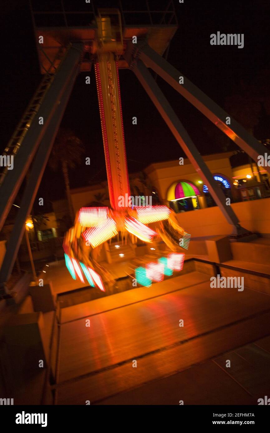 Lights glowing on a carnival ride at night, California, USA Stock Photo ...