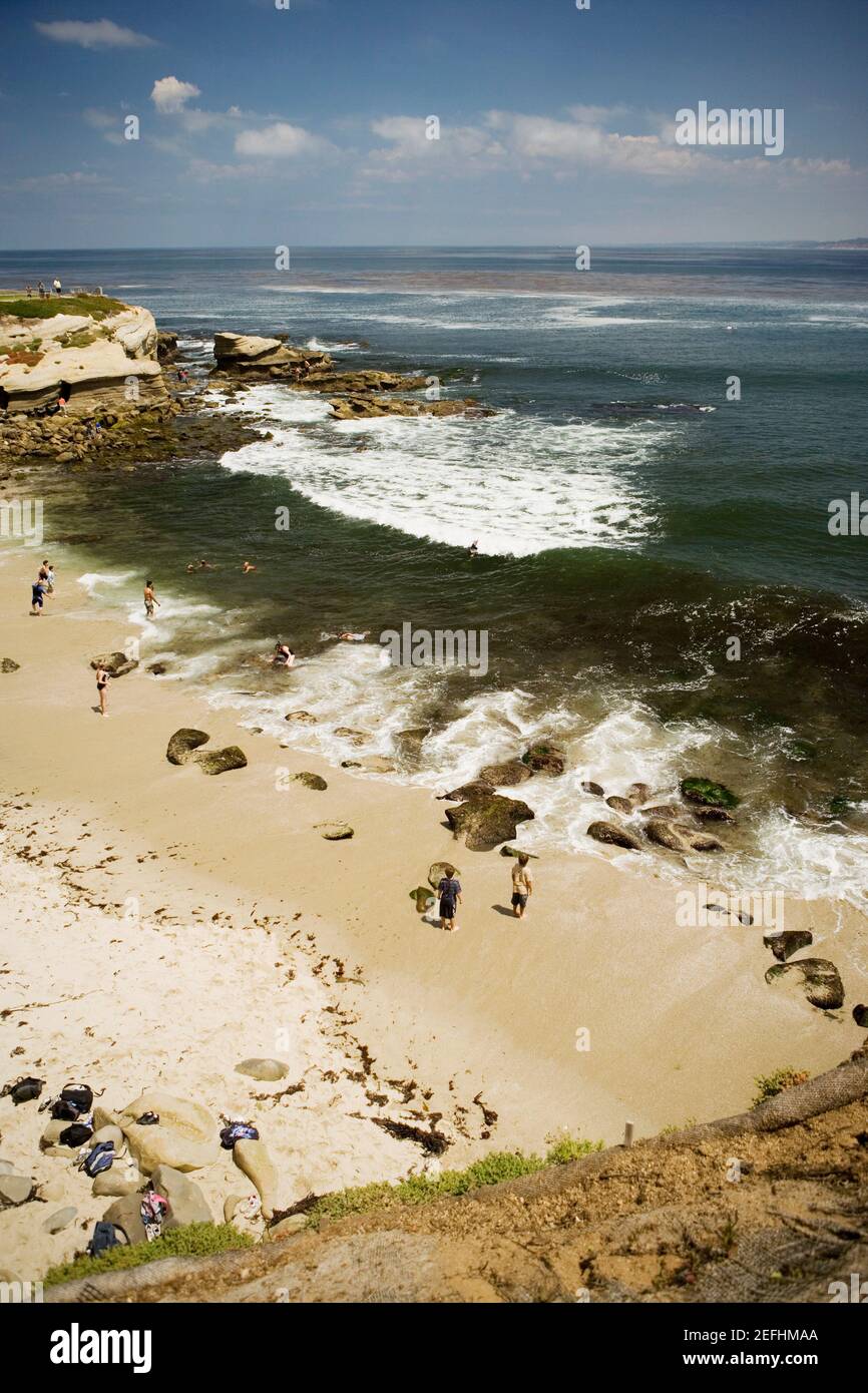 People resting on rocky beach hi-res stock photography and images - Alamy