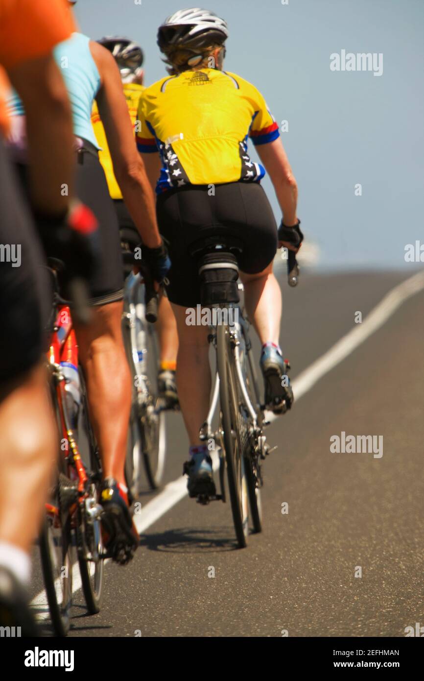 Woman bicycle field rear view hi-res stock photography and images - Alamy