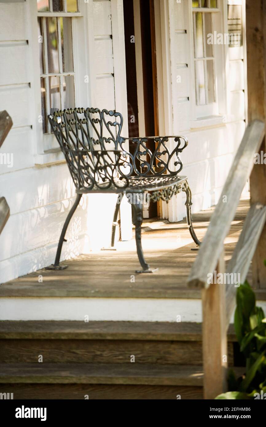 Side profile of a bench on a porch Stock Photo - Alamy