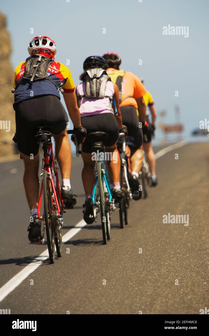 Woman cycling field rear view hi-res stock photography and images - Alamy