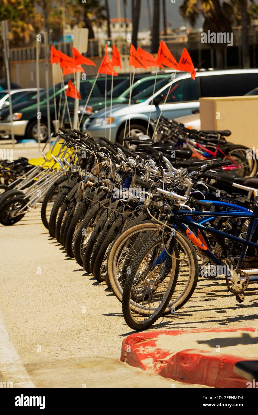 Side profile of cycles parked on a sidewalk Stock Photo - Alamy