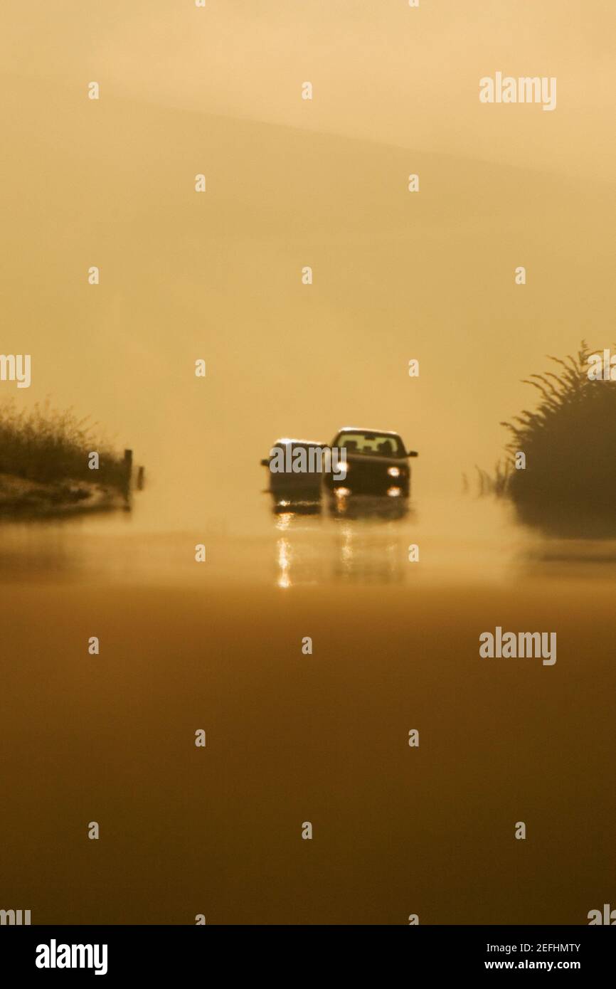 Two car moving on a road Stock Photo - Alamy