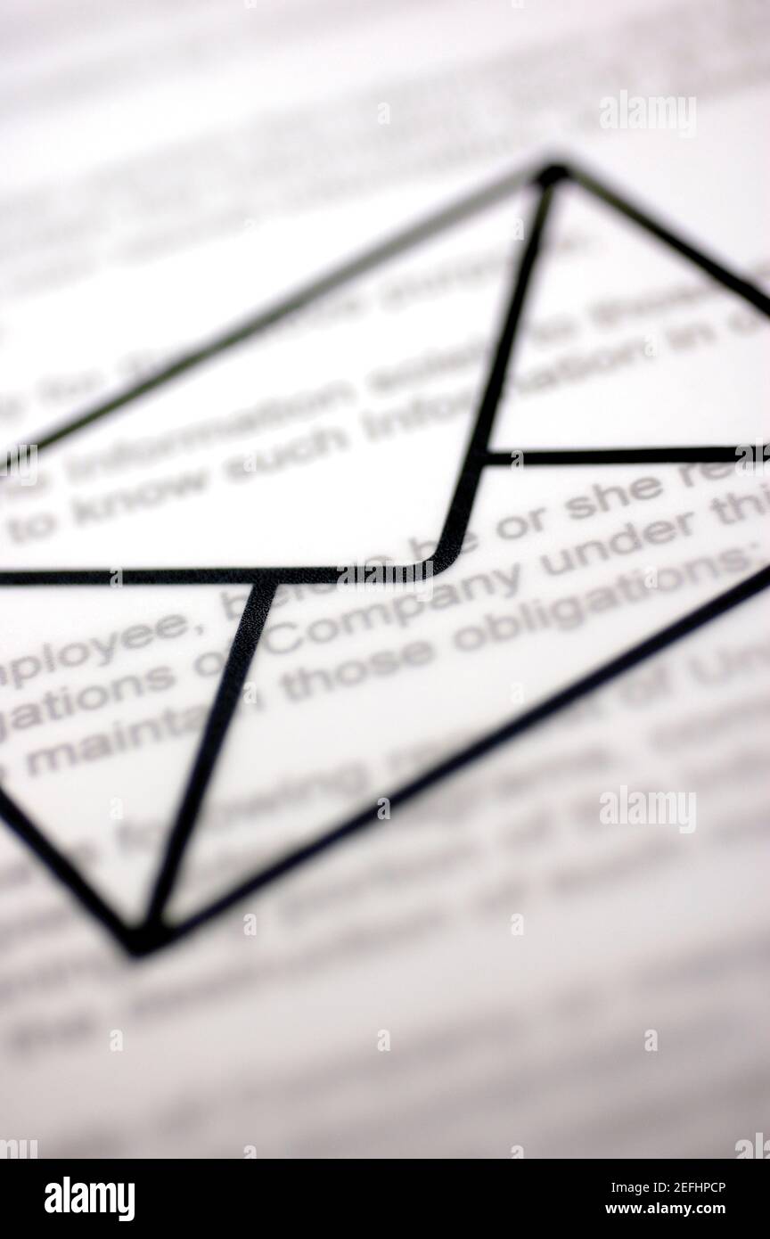 Close-up of an envelope sign over a document Stock Photo - Alamy