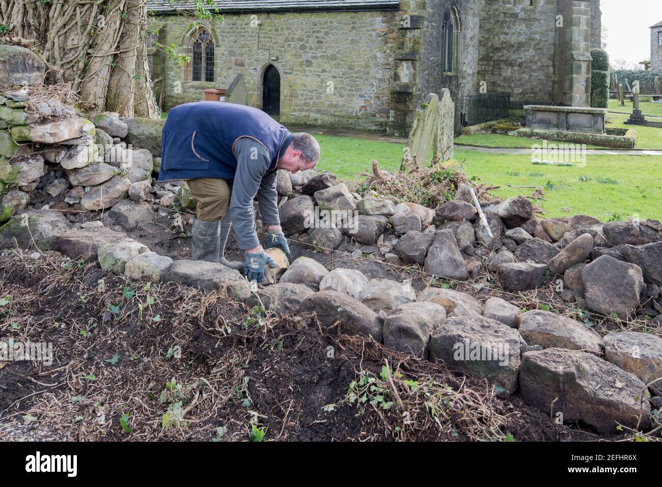 Drystone wall repair Stock Photo - Alamy