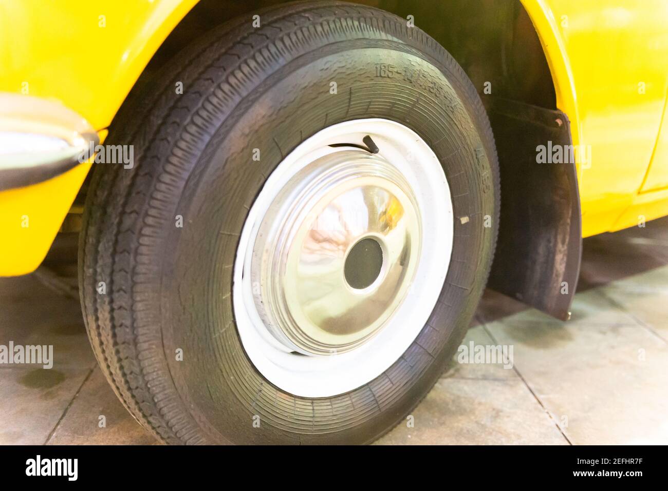 Wheel with a white disc. An old tire, on an old police car Stock Photo ...