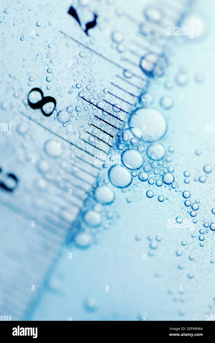 Close-up of a ruler in water Stock Photo - Alamy