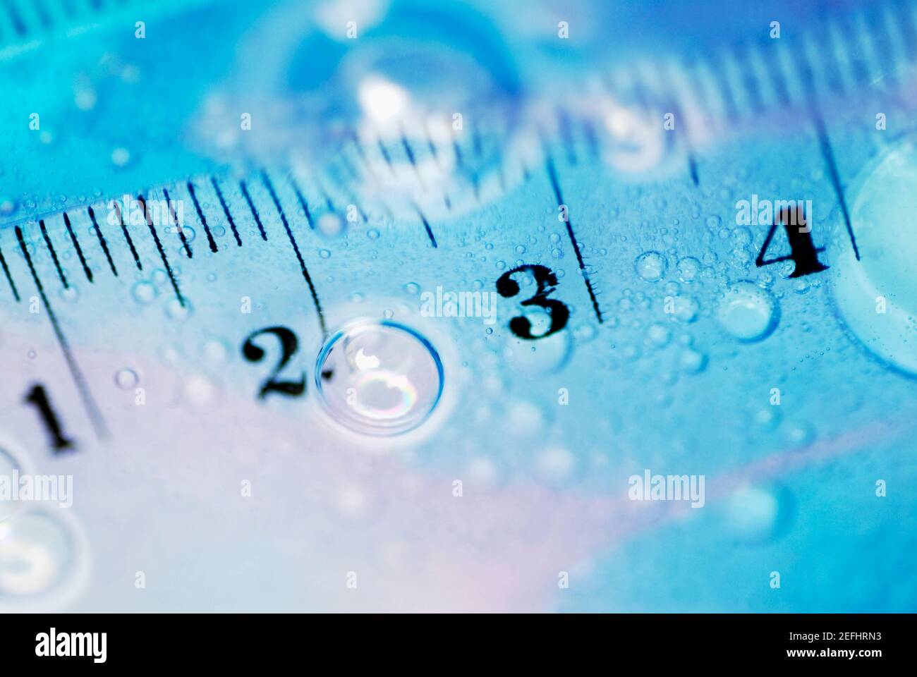 Close-up of a ruler in water Stock Photo - Alamy