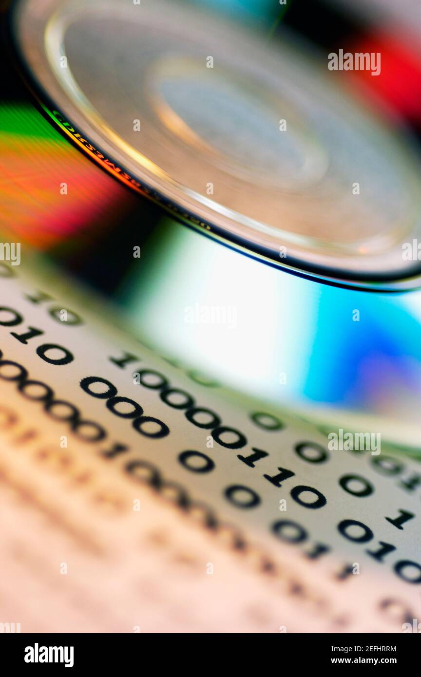 Close-up of a CD and binary code Stock Photo - Alamy