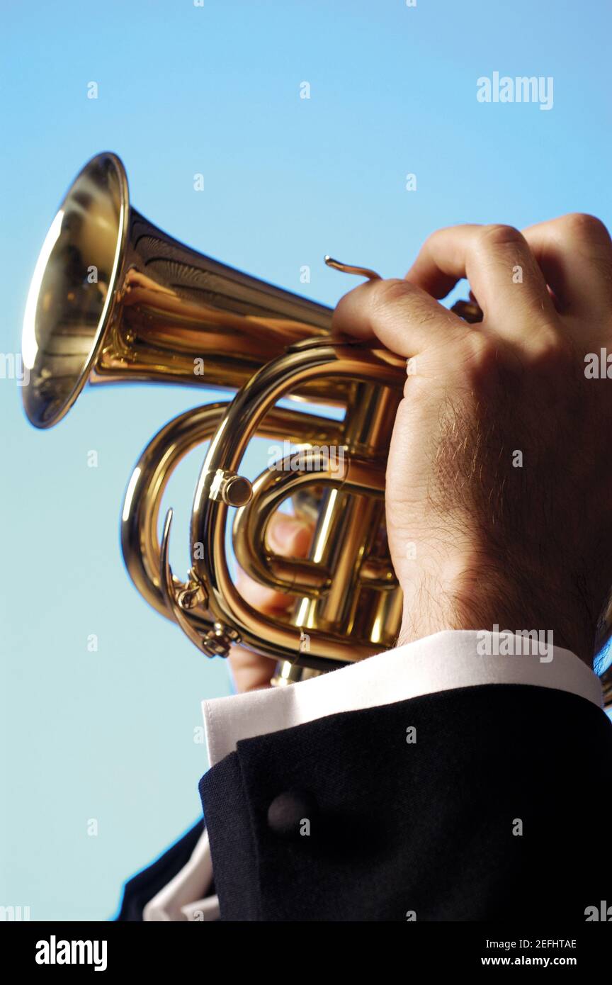 Hand holding trumpet hi-res stock photography and images - Alamy