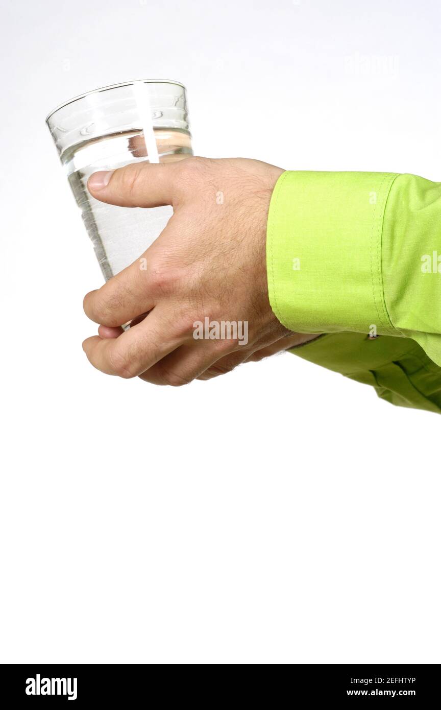 Close up hand holding water glass hi-res stock photography and images ...